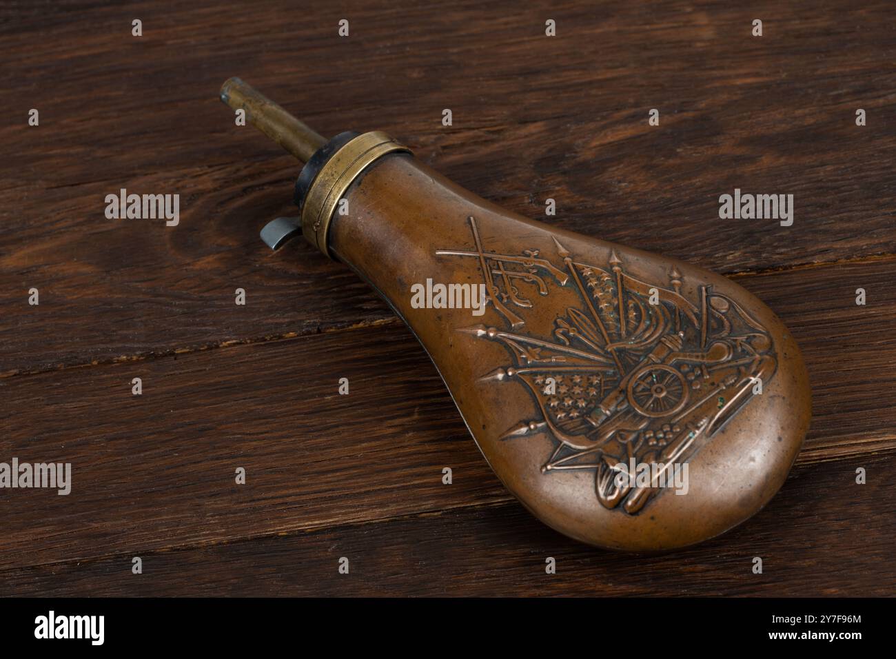 Old west gunpowder flask on wood deck background Stock Photo - Alamy