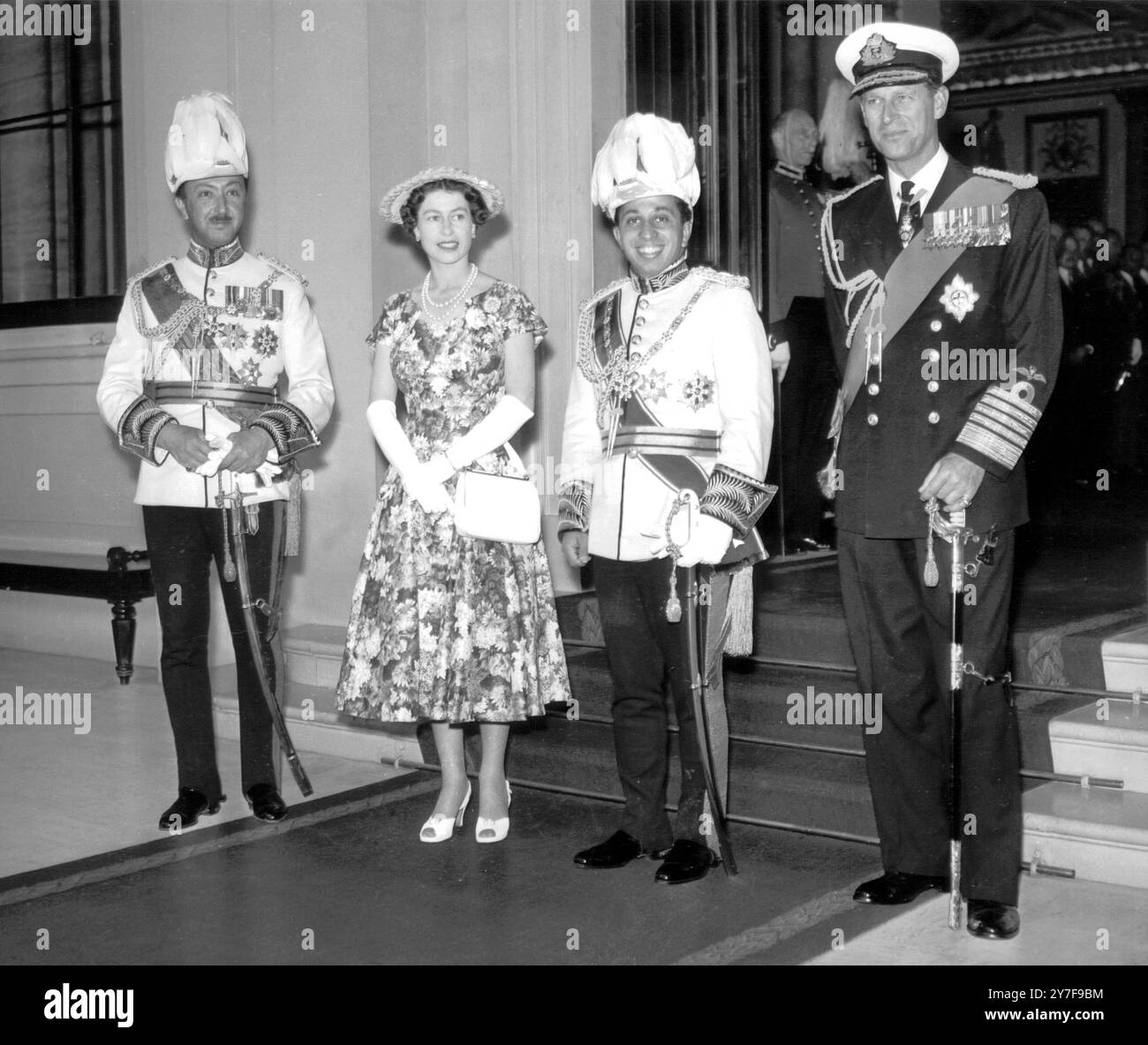 Posing for a formal photograph in the forecourt of Buckingham Palace ...