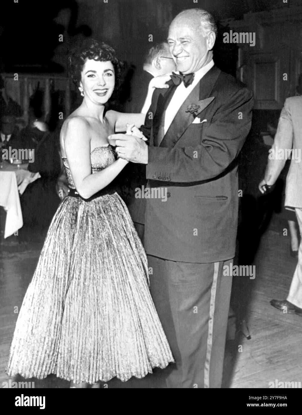 Elizabeth Taylor dancing with Conrad Hilton, Chairman and President of ...