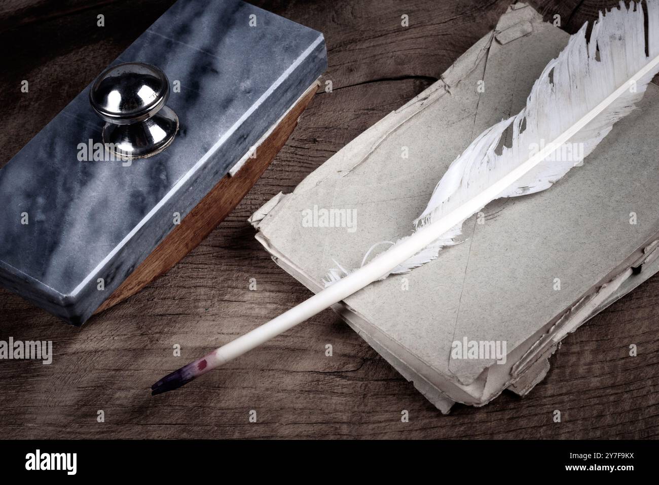 Vintage retro fountain pen and inkwell with old letters on a wooden ...