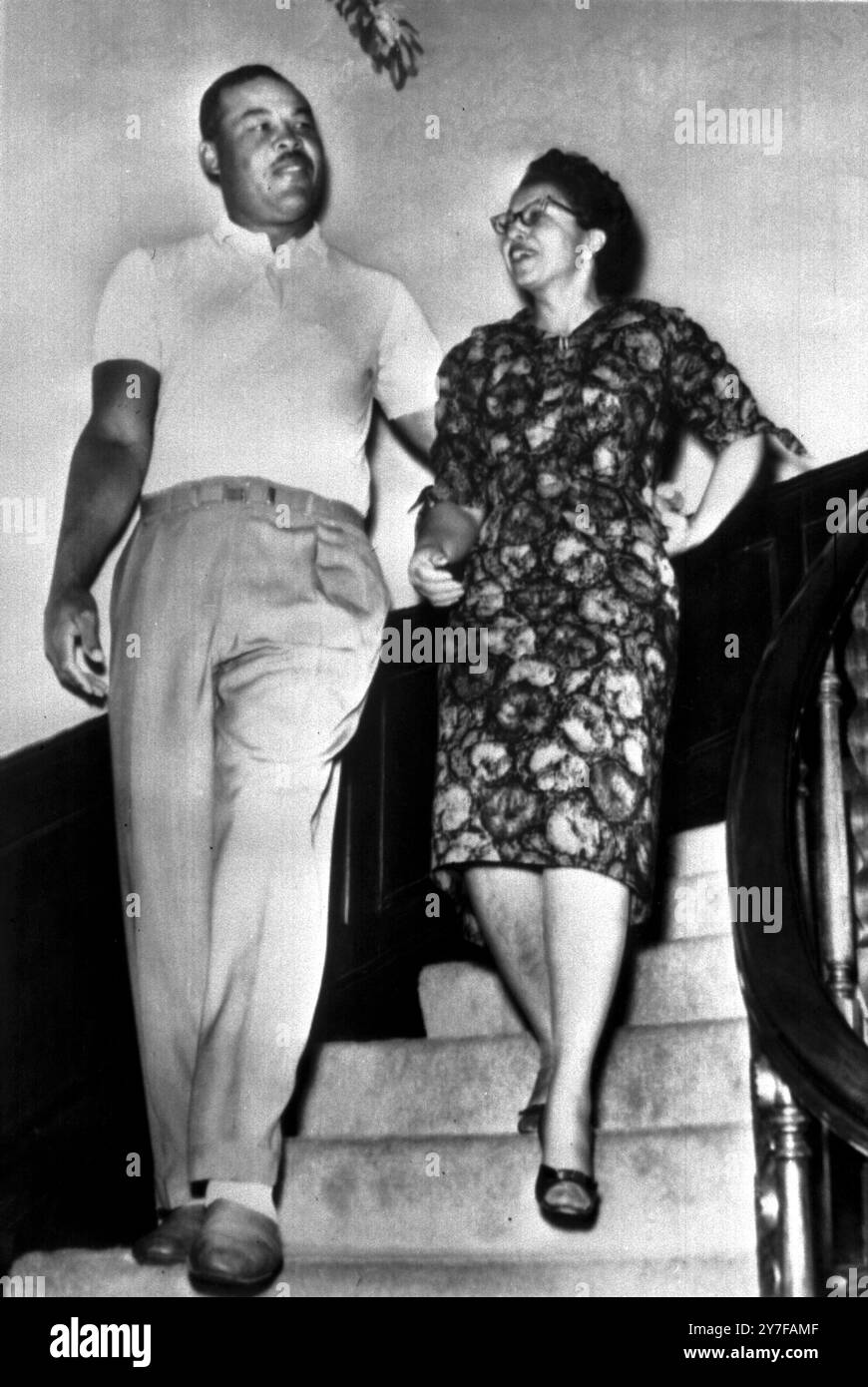 Joe Louis puts his arm around the shoulders of his bride Mrs Martha ...