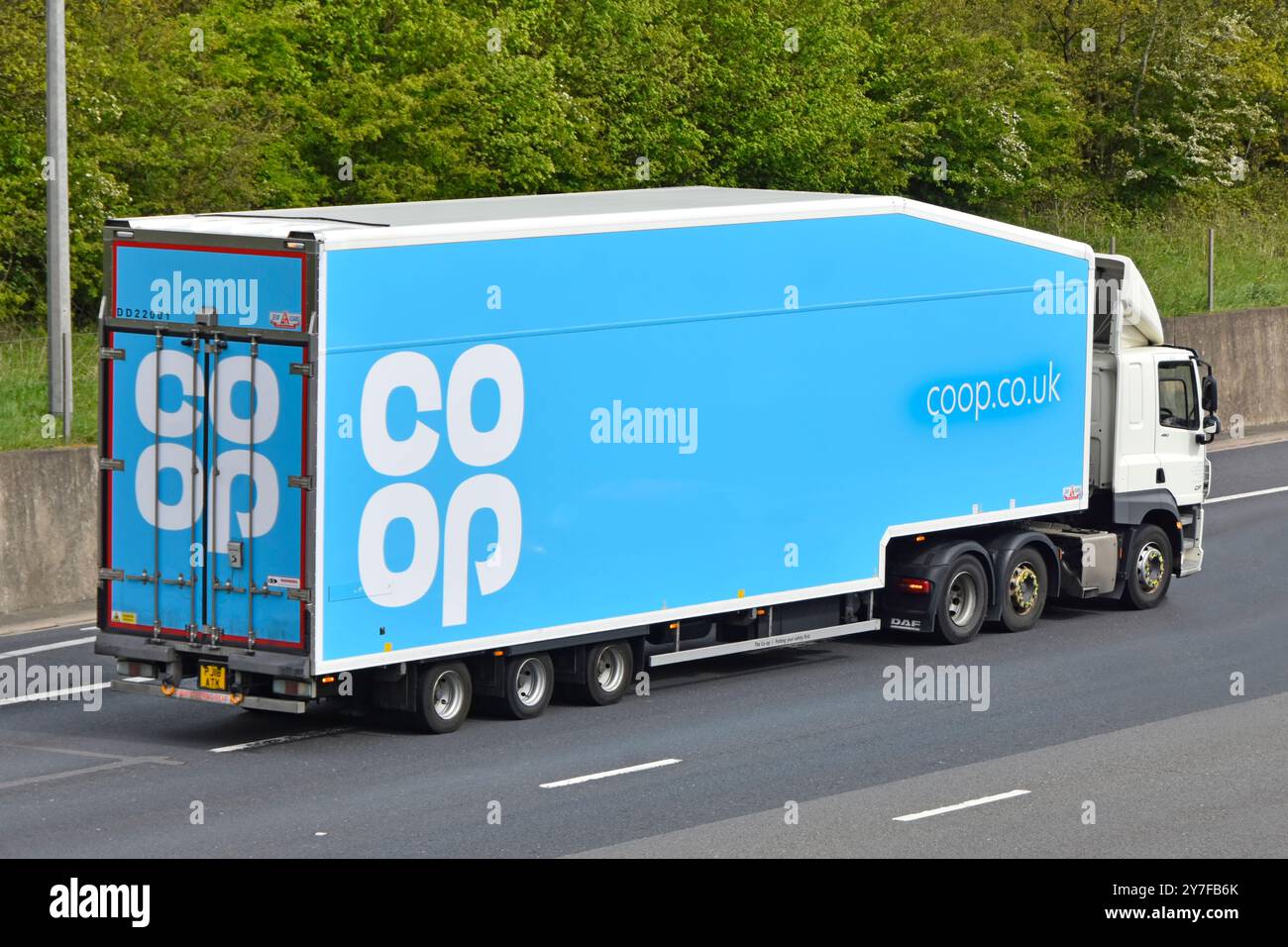 Co-op trade name brand logo view on side & back doors blue semi trailer ...