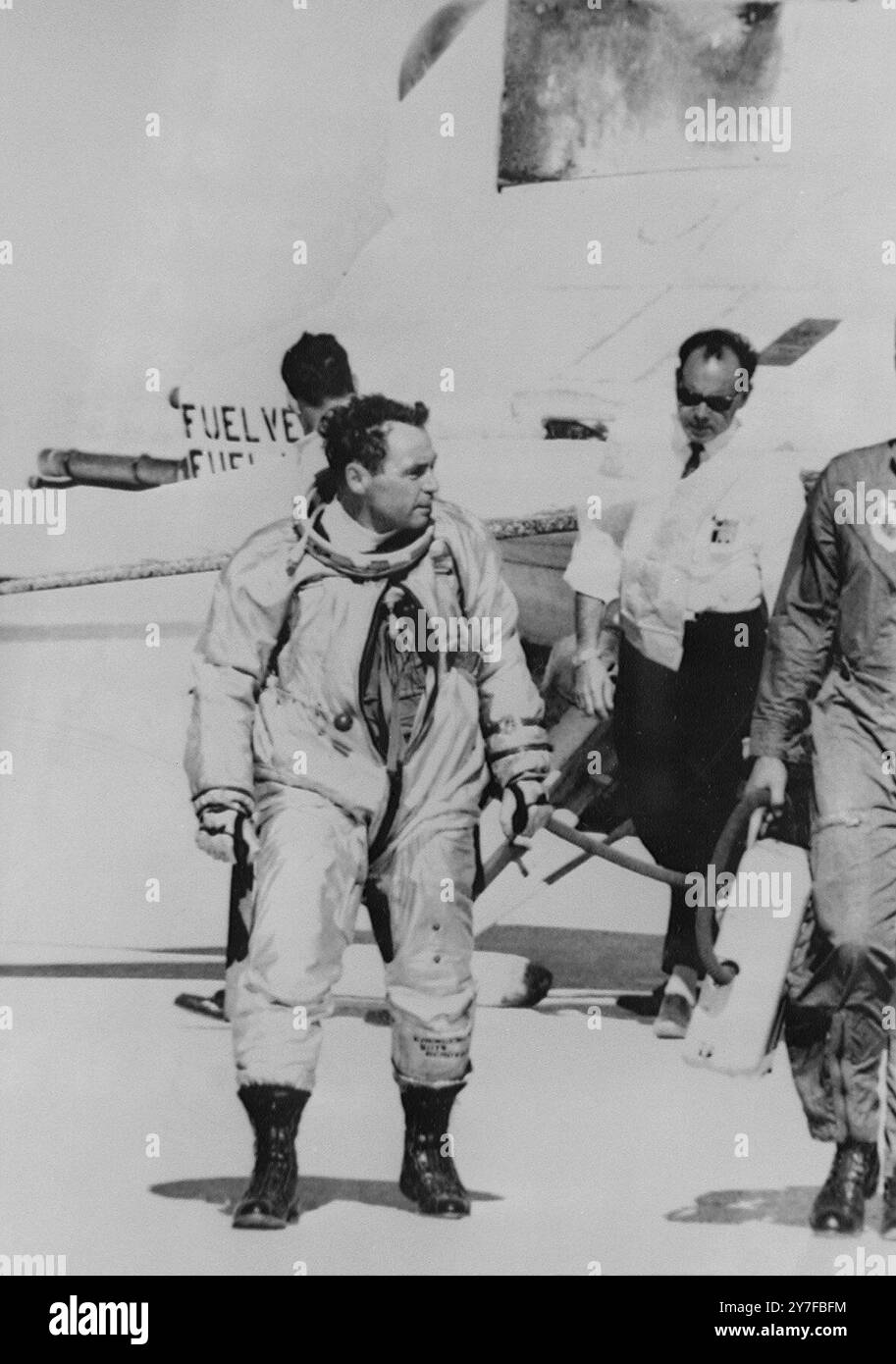 Major William Knight walks away from the scorched tail section of the X ...