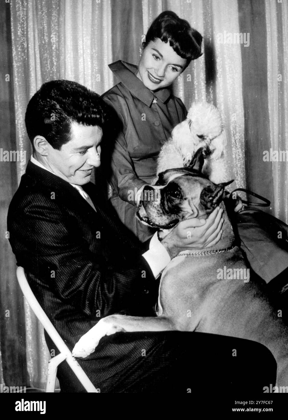 Eddie Fisher with his boxer 'Junior' and his wife Debbie Reynolds with ...