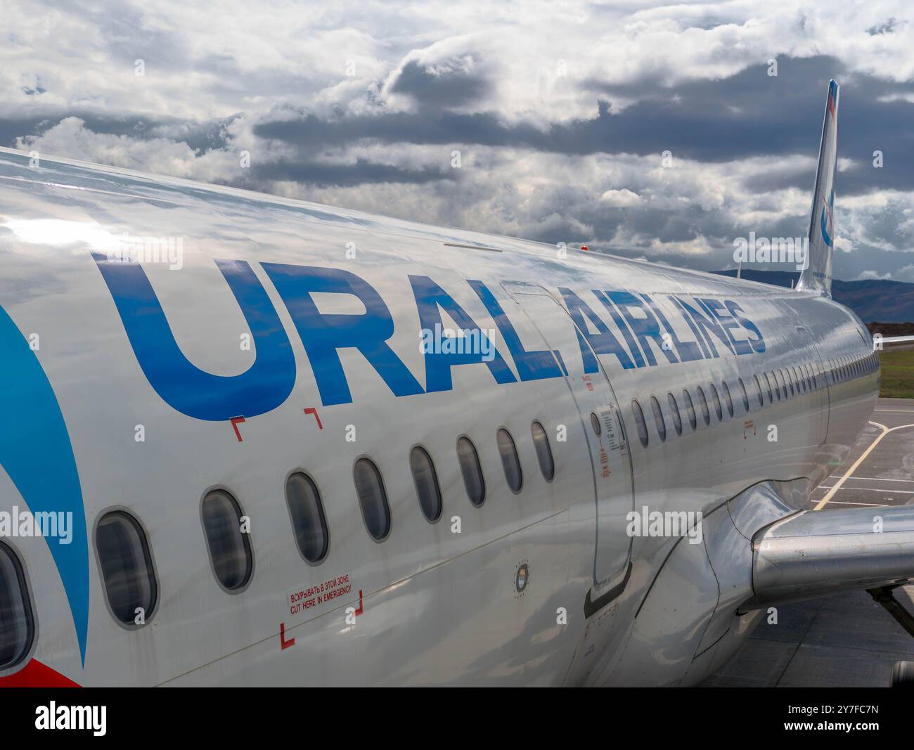 Close-up of the "Ural Airlines" marking painted on the fuselage of an ...
