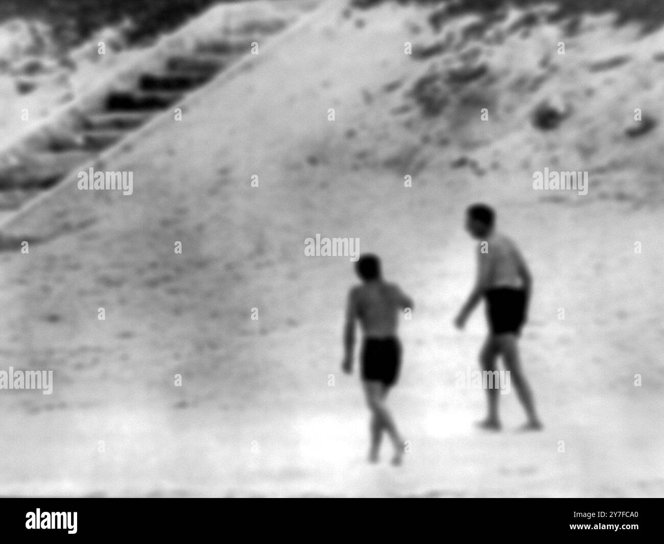 US President John F Kennedy relaxes on the beach with John Kenneth ...