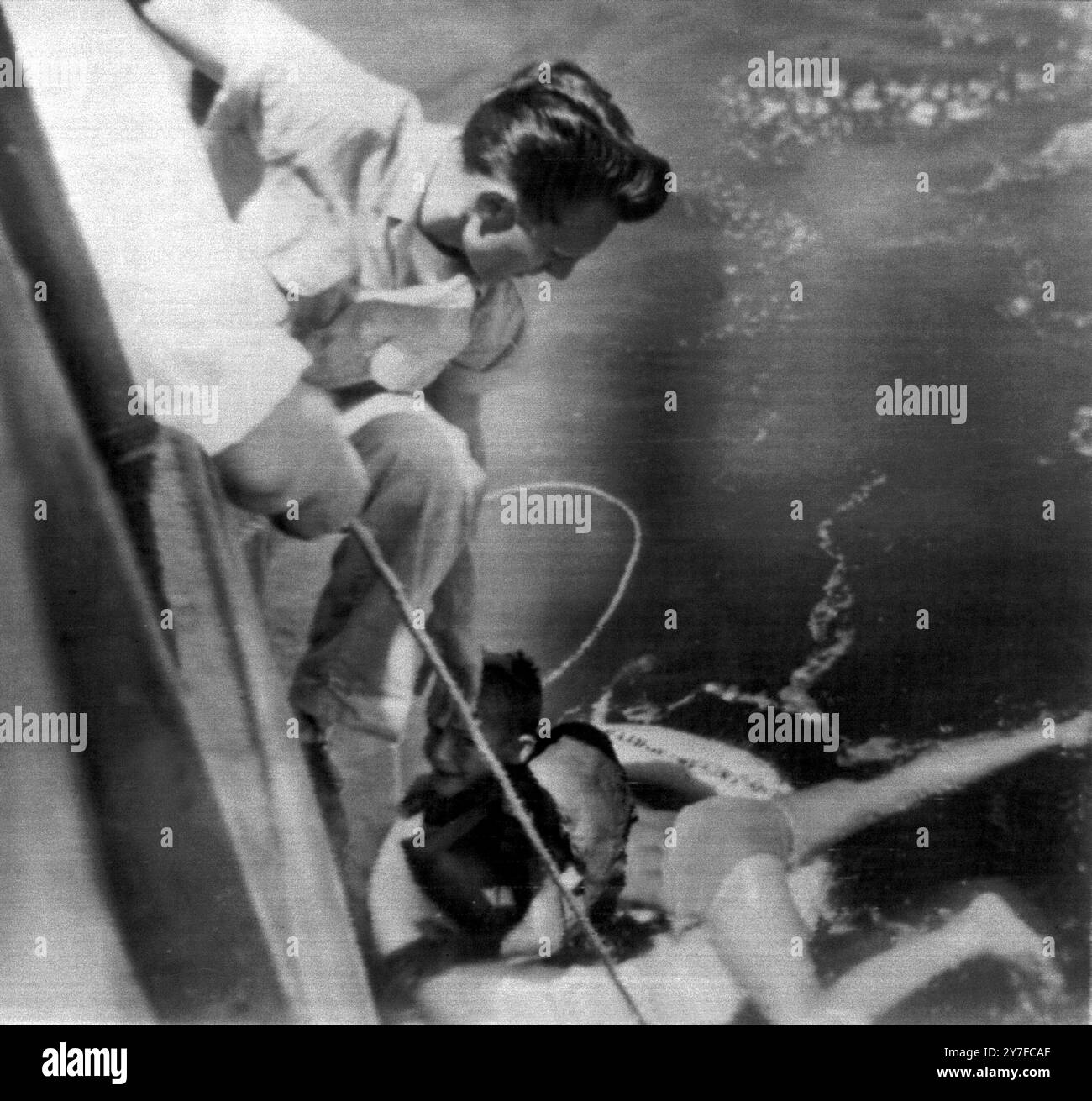 Eight year old Roger Woodward is pulled on board the Maid of Mist ...