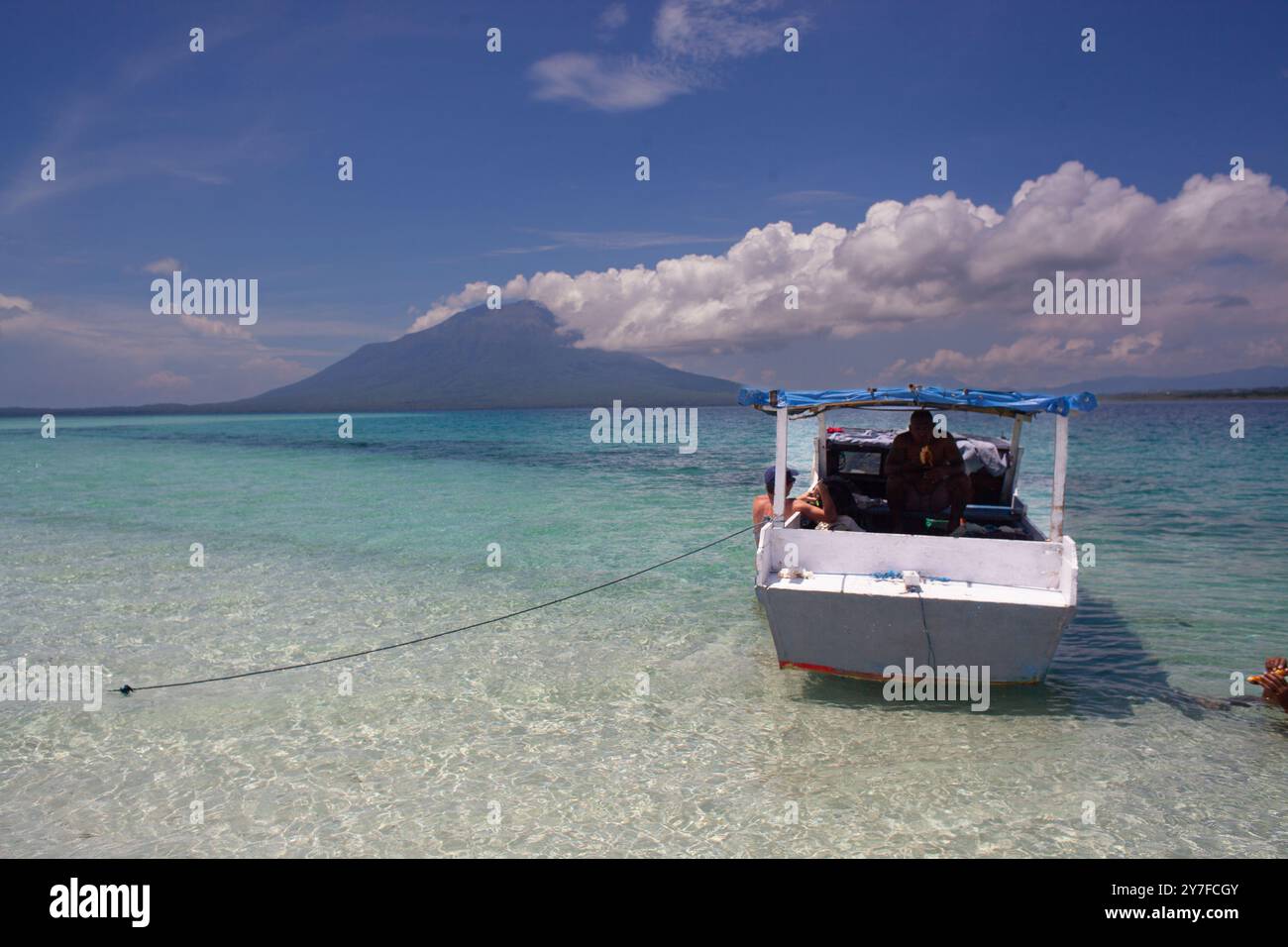 Fishing boat moored on a tropical beach in Lemmata, Indonesia Stock ...