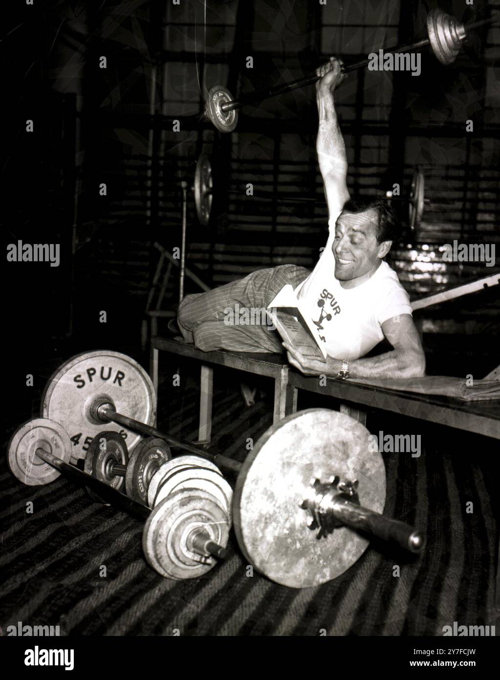TV comedian Max Wall weightlifting 16th August 1954 Stock Photo - Alamy