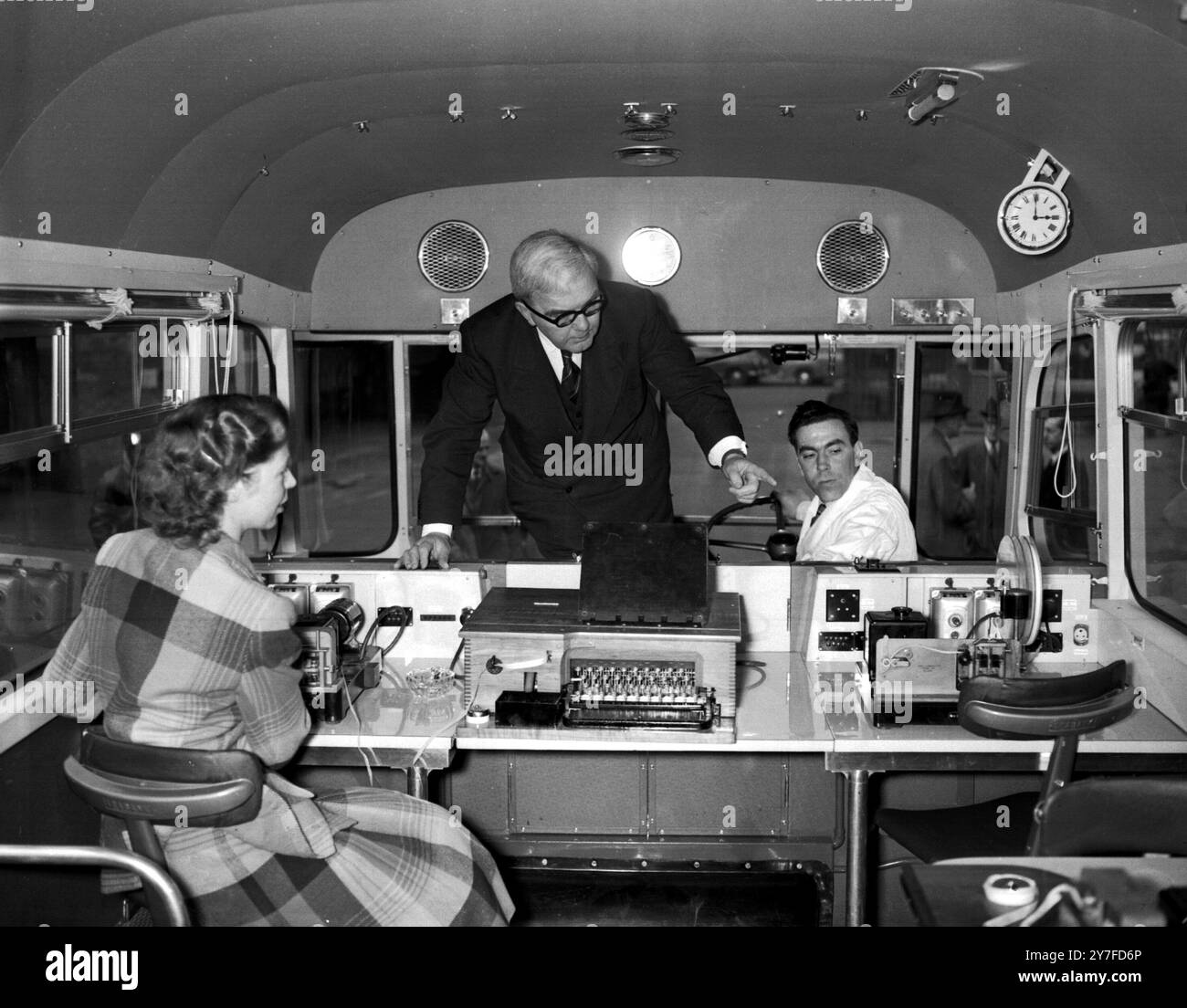 Britain's Post Master General, Dr Charles Hill views the interior of a ...