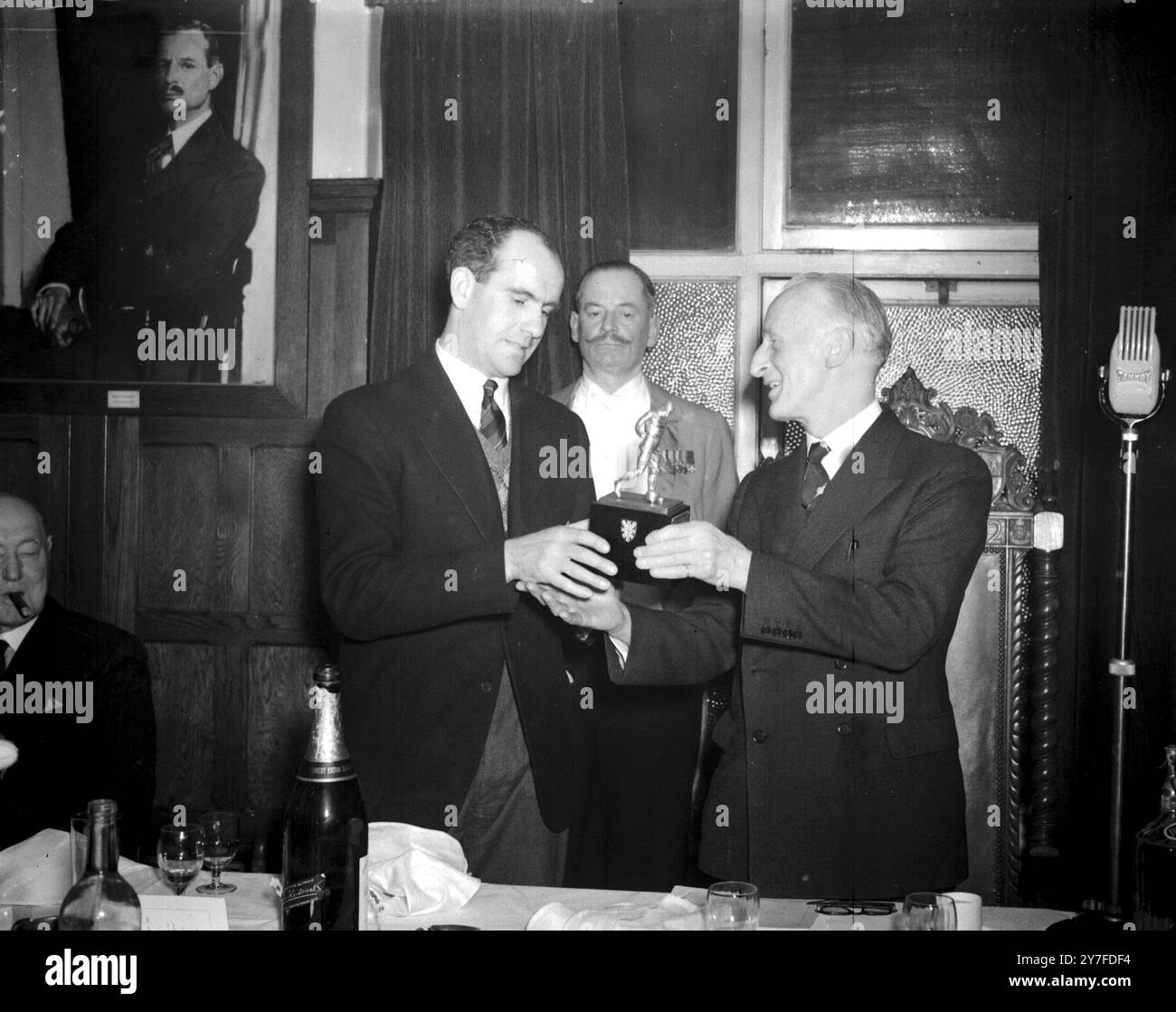 John Carey is presented with the Footballer of the Year trophy by Mr ...