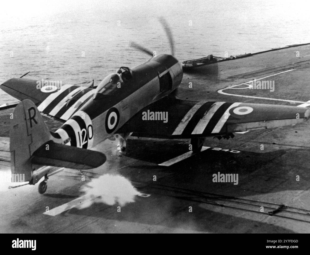 Korean War British Sea Fury aircraft is catapulted from the flight deck ...