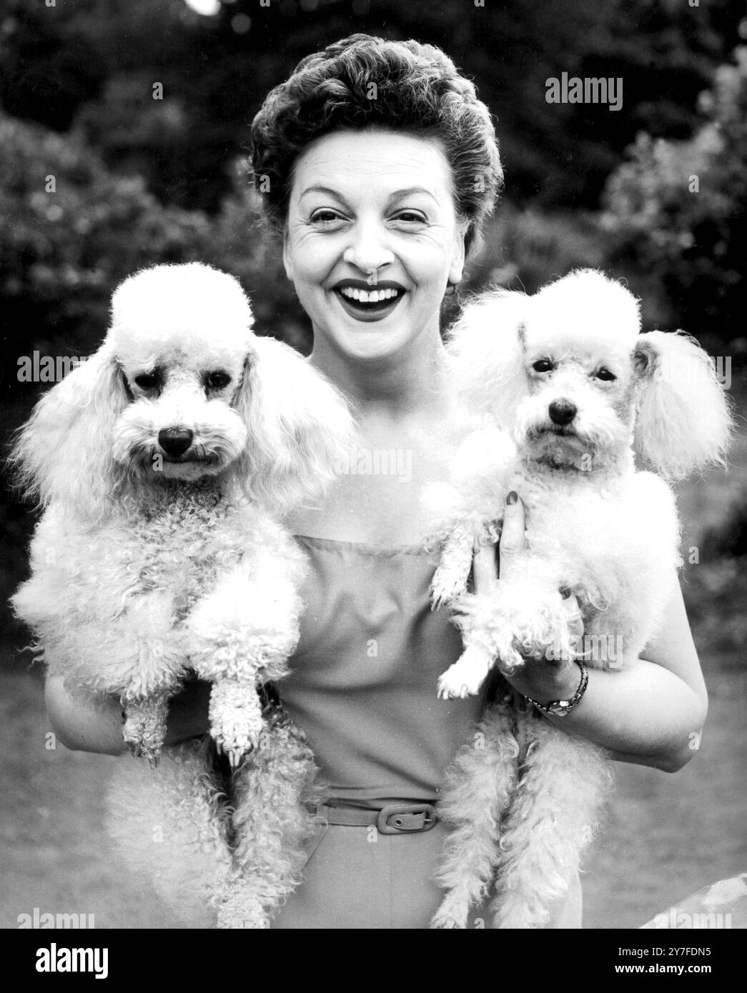 Betty Driver holding her famous poodles Mitzi (left) and Tina (right ...