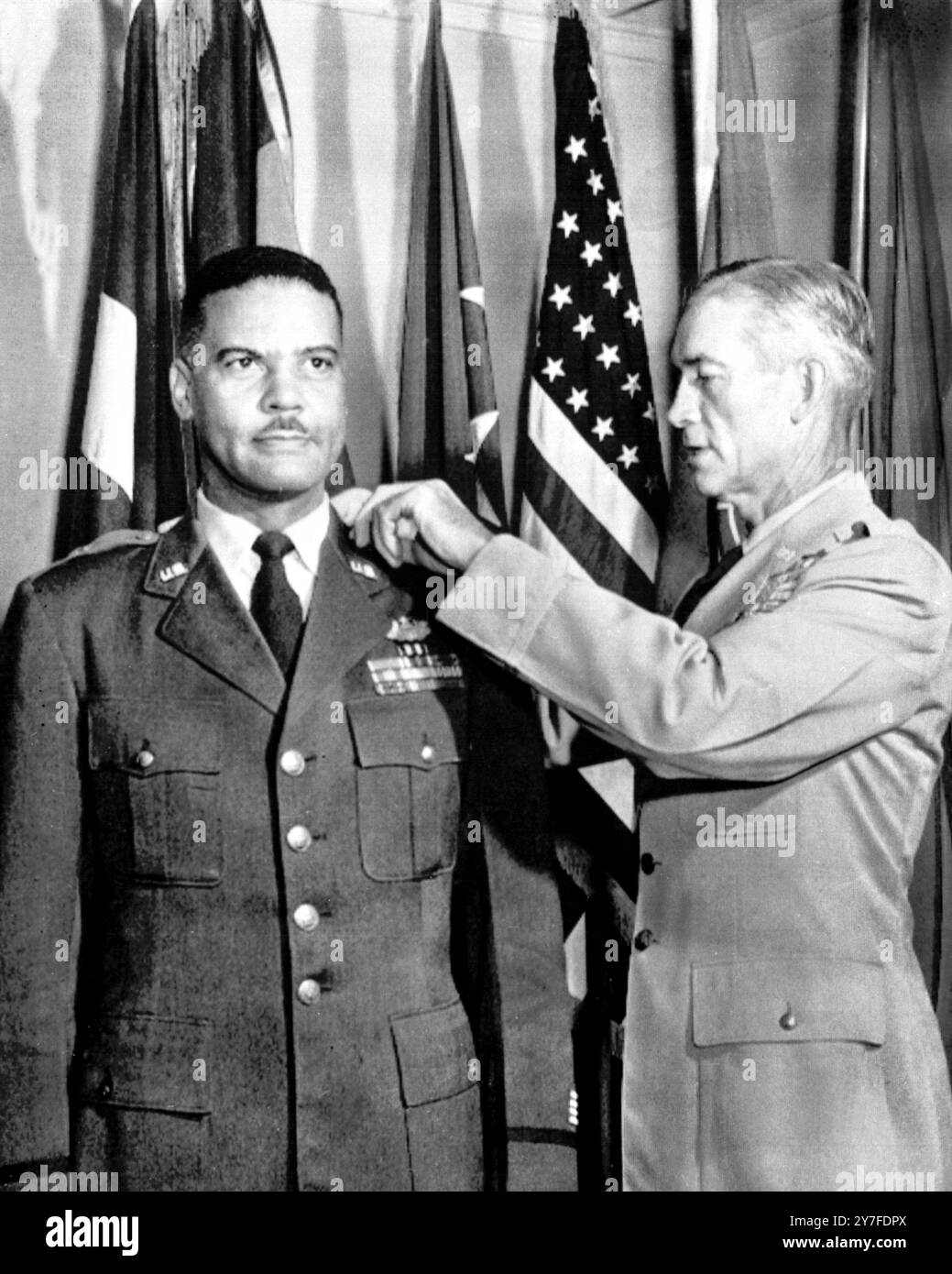 Tokyo, Japan. - General Earle E. Partridge (right) presents the stars ...
