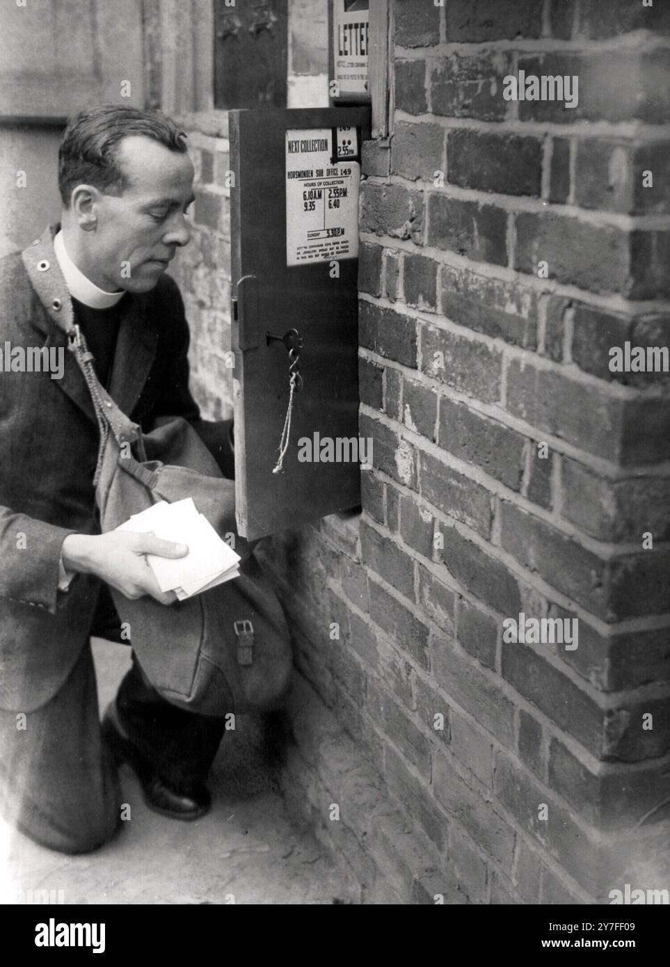 Home Front 1940 - Rev. R D Richards collecting the main as a temporary ...