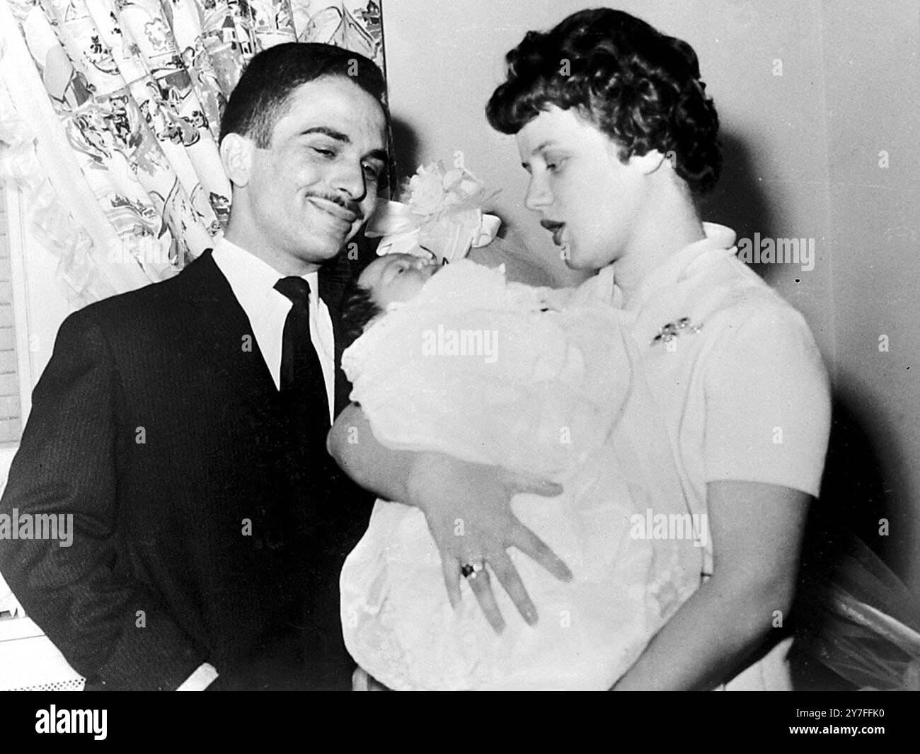 A happy King Hussein of Jordon looks on as his British born wife ...