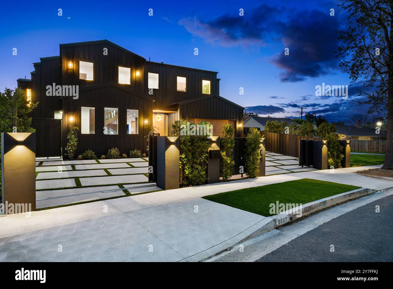 Modern luxury house exterior with well-lit facade and contemporary ...