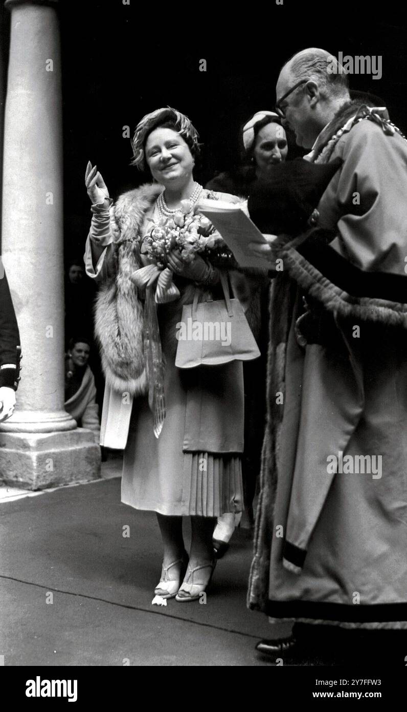 Queen Elizabeth, the Queen Mother waves to acknowledge the cheers of ...