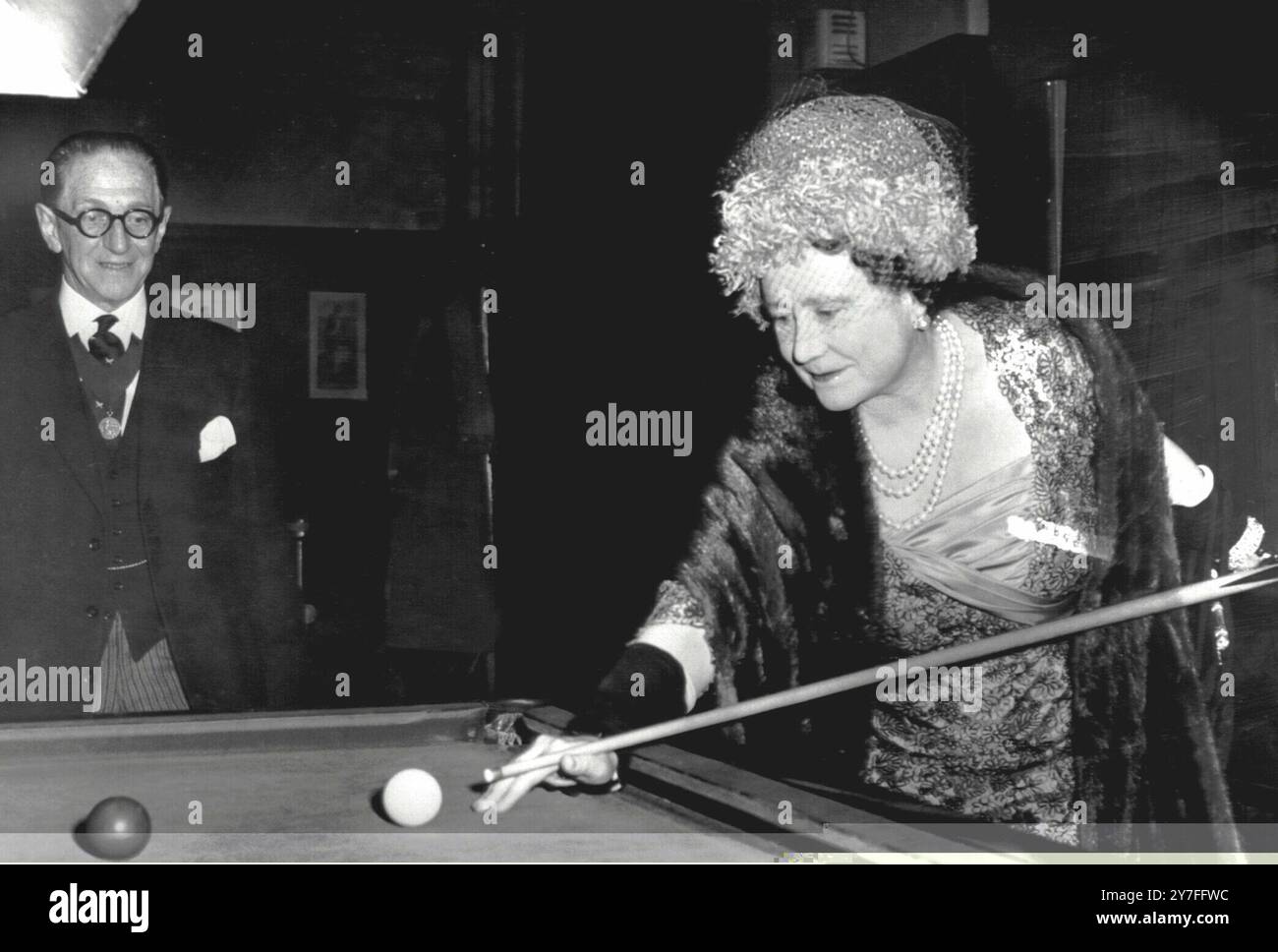 Queen Elizabeth, The Queen Mother playing billiards at the London Press ...