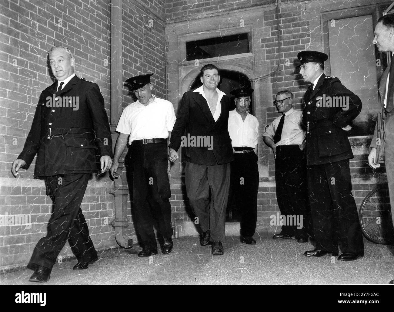 Wardens lead Frank Samuel Mitchell from Hartley Wintley Police Station ...