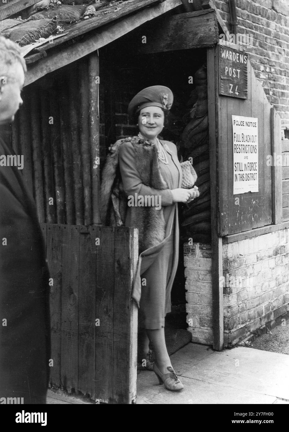 Queen Elizabeth (The Queen Mother) visits a wardens post during WWII ...