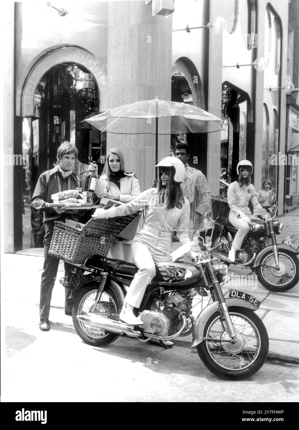 CATSUITED GIRLS ON MOTOR CYCLES AS FLYING SQUAD SERVICE OF FOODS ...