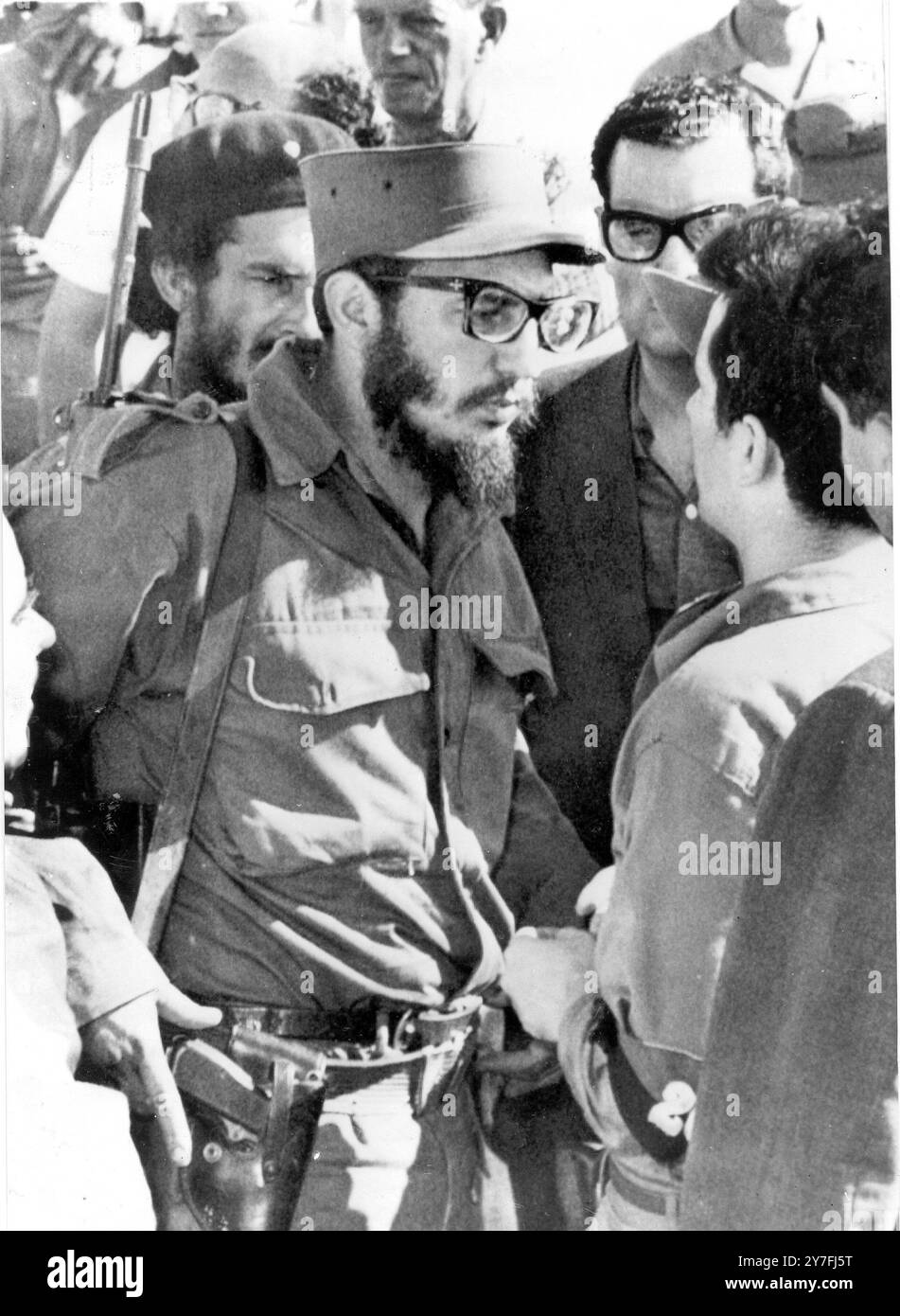 Fidel Castro Cuban rebel leader one hand on his gun speaking with some ...