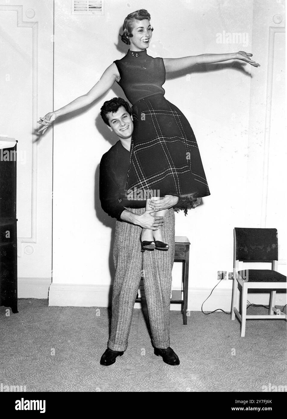 Tony Curtis and Janet Leigh whom he married six months ago limbering up ...