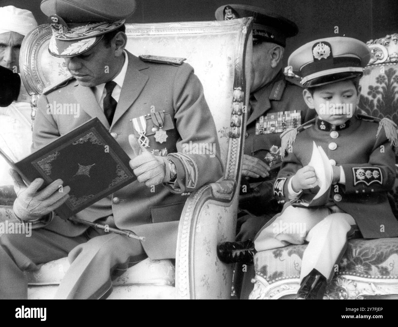 Clad in his military uniform is young Prince Sidi Mohammed sitting ...