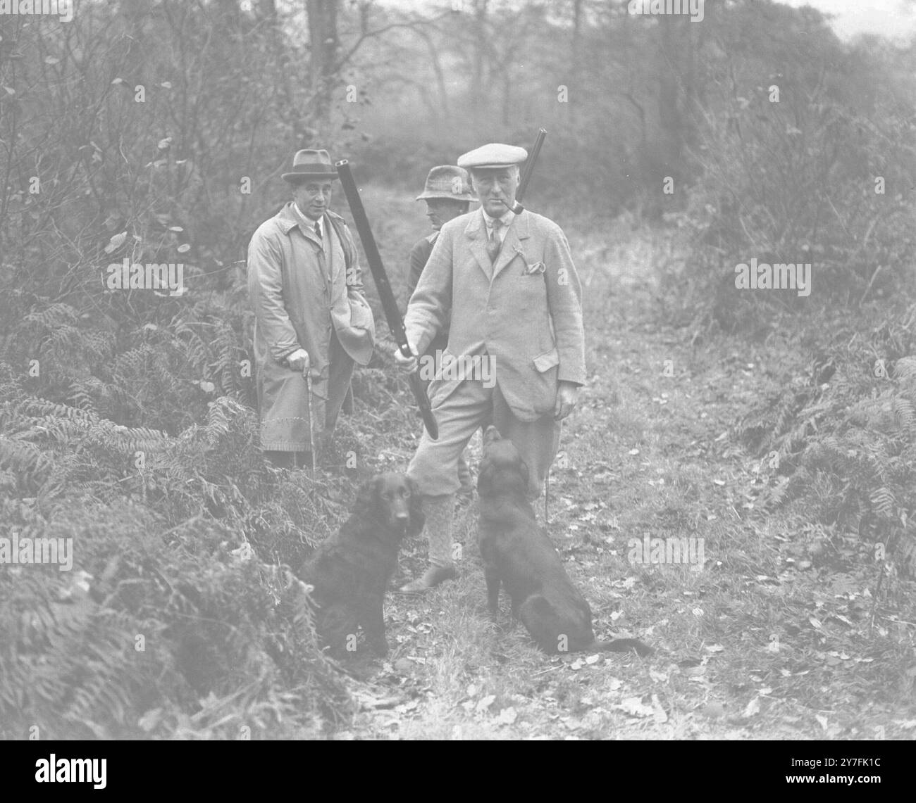 The Hon E.A.D Ryder enjoying a pipe between drives at the Earl of ...
