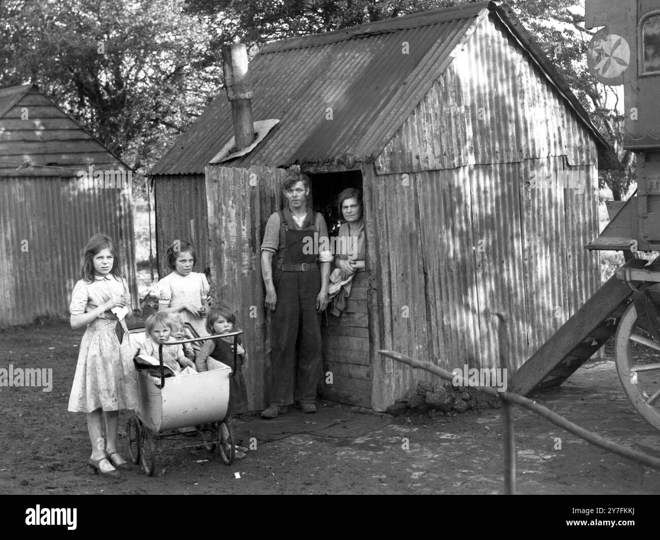 Family living in a hut Stock Photo - Alamy
