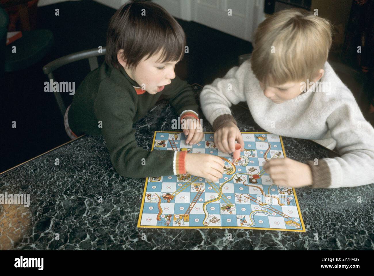 Playing snakes and ladders hi-res stock photography and images - Alamy
