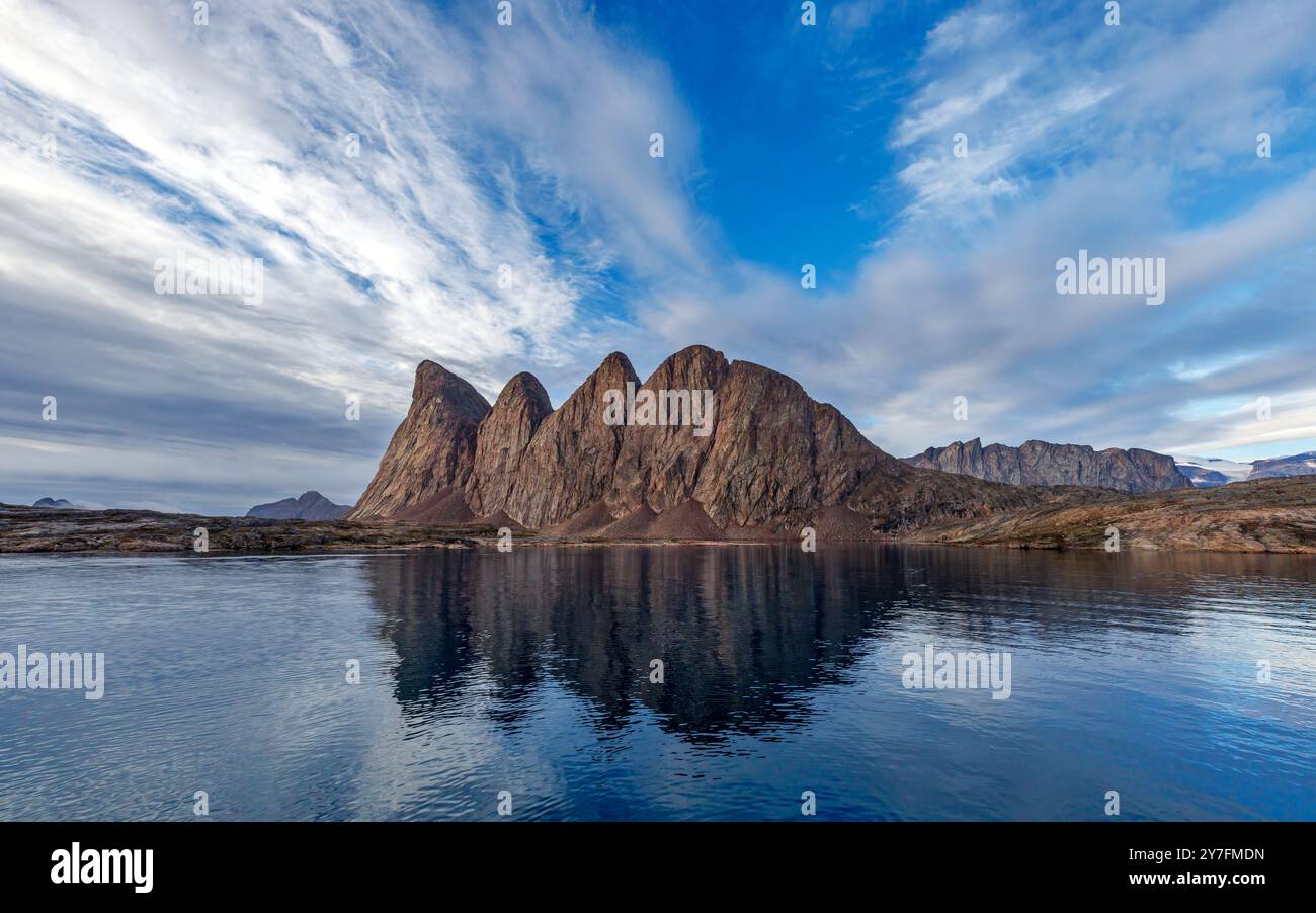The rugged mountains of the Bear or Bjorne Islands, reflected in the ...