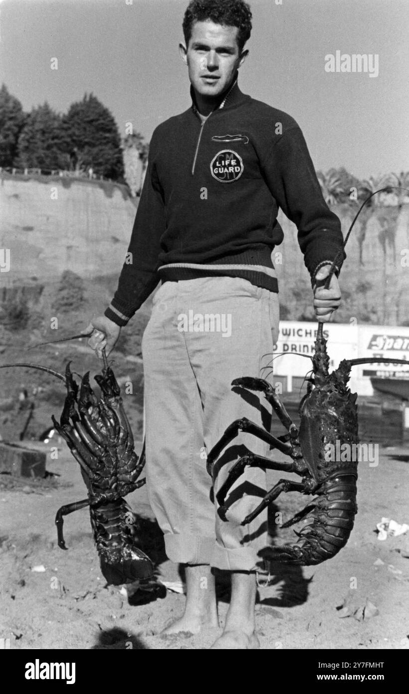 An off duty lifeguard on Santa Monica beach with a lobster, California ...