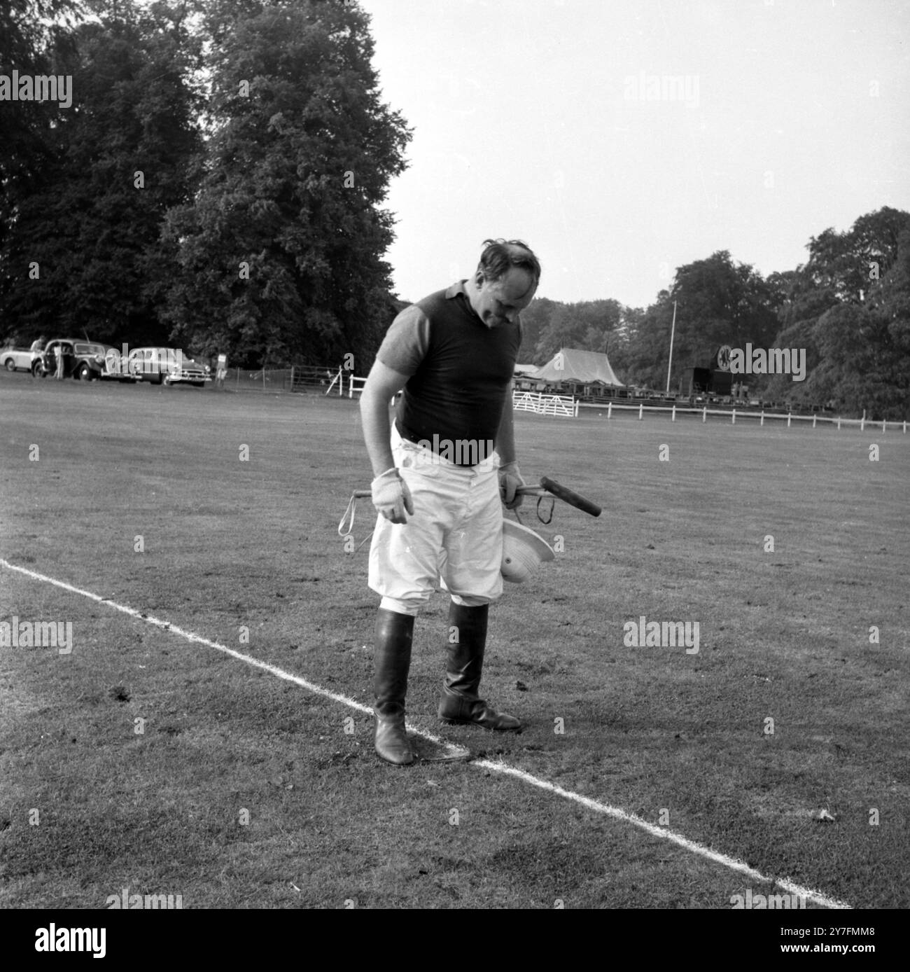 Jimmy Edwards, actor and comedian treading in the divots at halftime ...