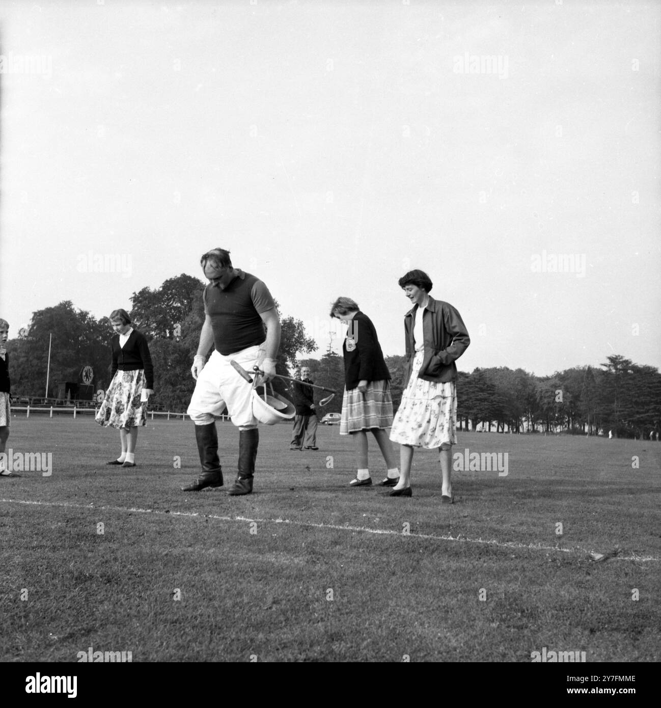 Jimmy Edwards, actor and comedian treading in the divots at halftime ...