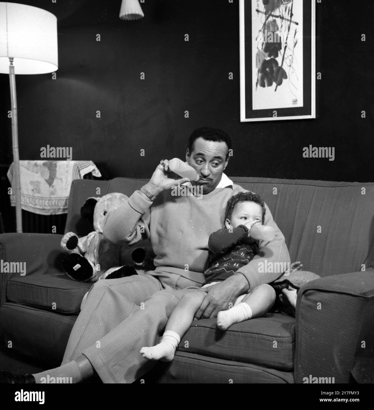 Ray Ellington, 1915-1985, at home in London with his son Lance by wife ...