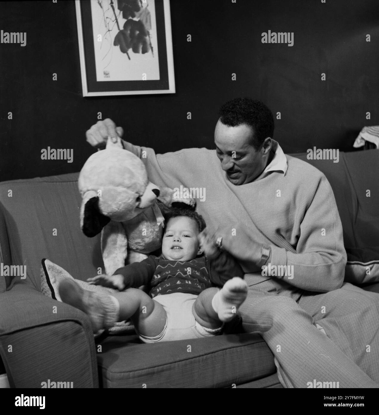 Ray Ellington, 1915-1985, at home in London with his son Lance by wife ...