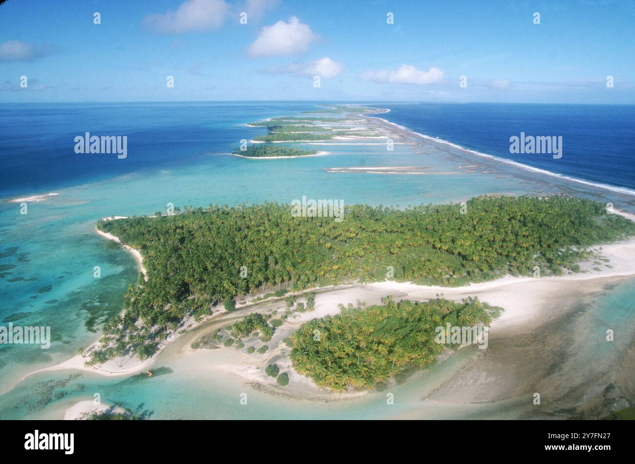 An aerial view of the buildings and thin strips of coral land that ...