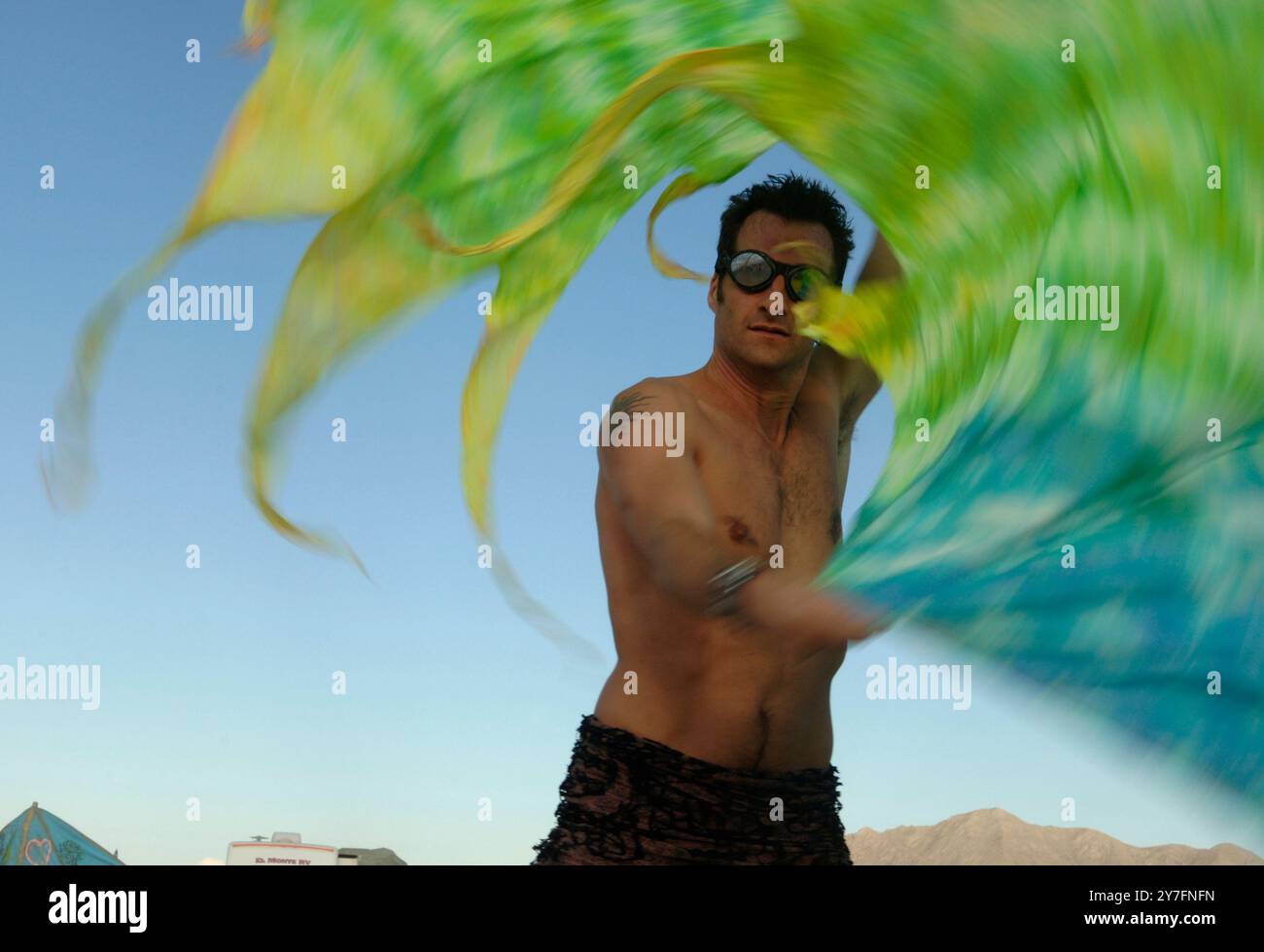 A dancing man at Burning Man Festival in the Red Rock Desert of Nevada ...