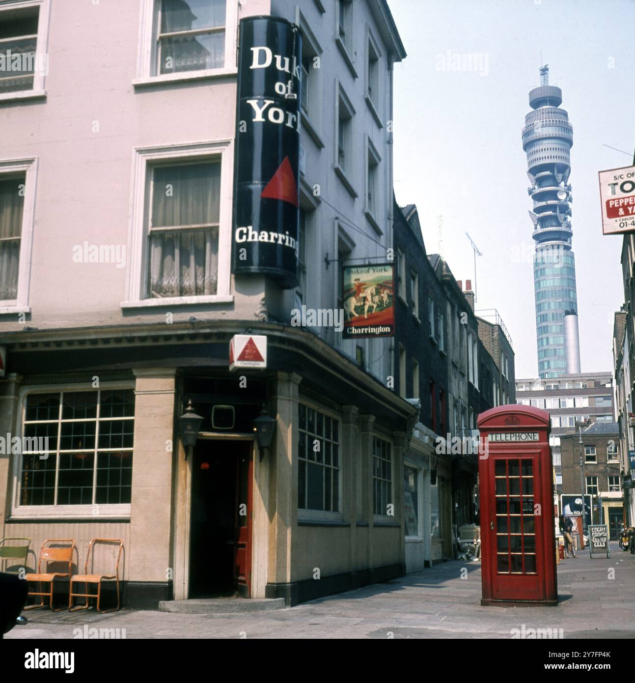 The Duke of York pub and red telephone box with the GPO Tower in ...