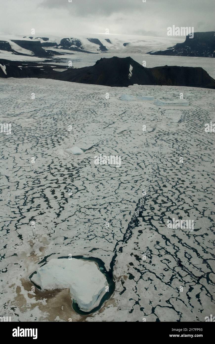 An aerial view of the Weddell see with glacial ice frozen in by sea ice ...
