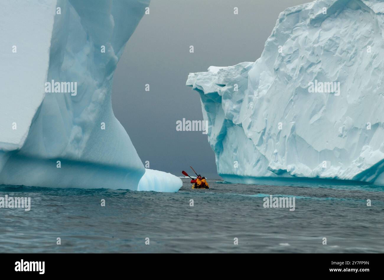 Kayakers paddle through Paradise Bay in the west coast of Antarctica's ...