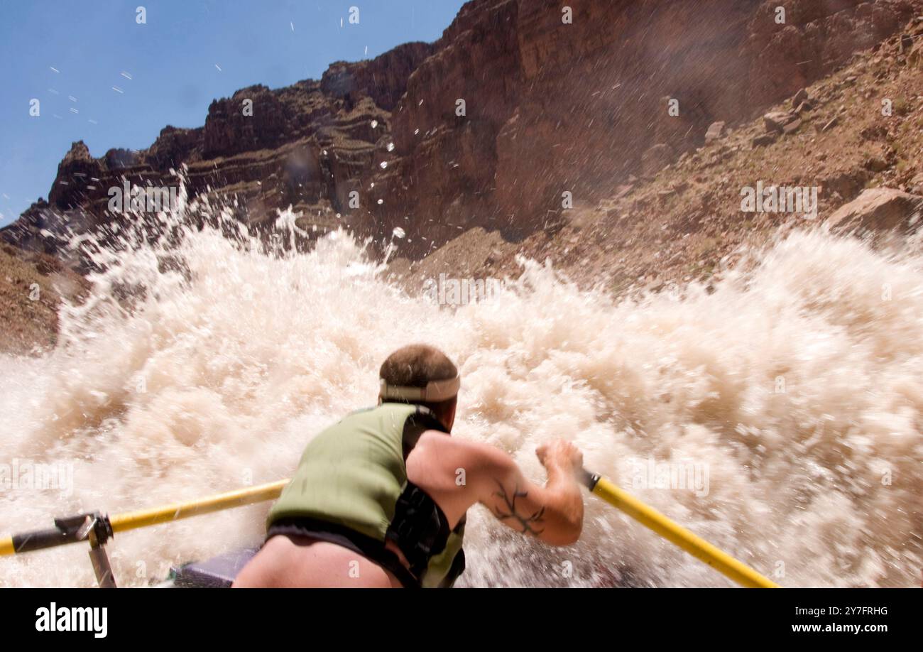 A river guide directs his raft through rapids Stock Photo - Alamy
