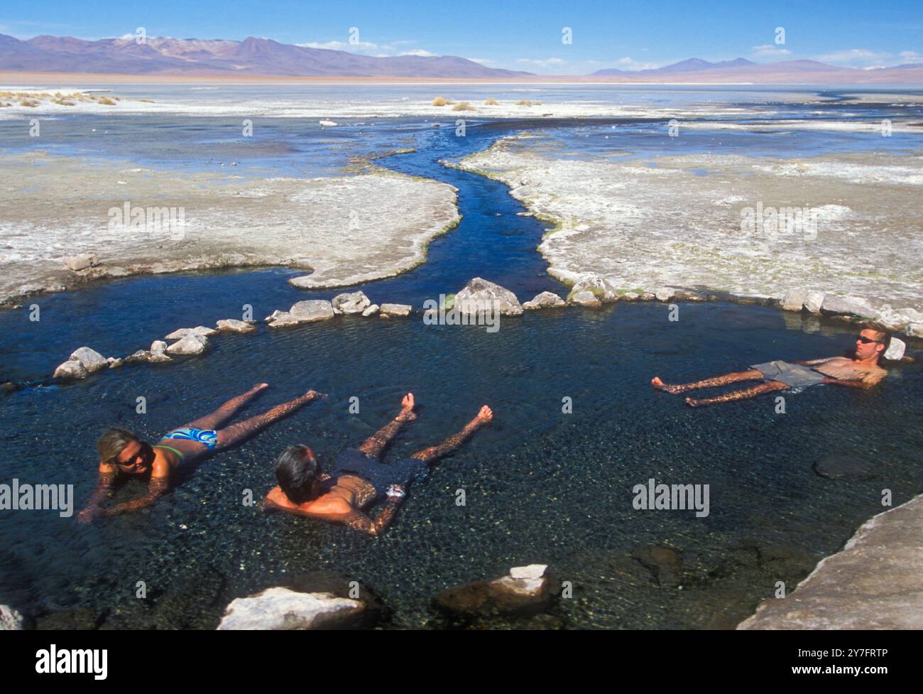 Adults bathing in hot springs of the Atacama Desert in Chile Stock ...