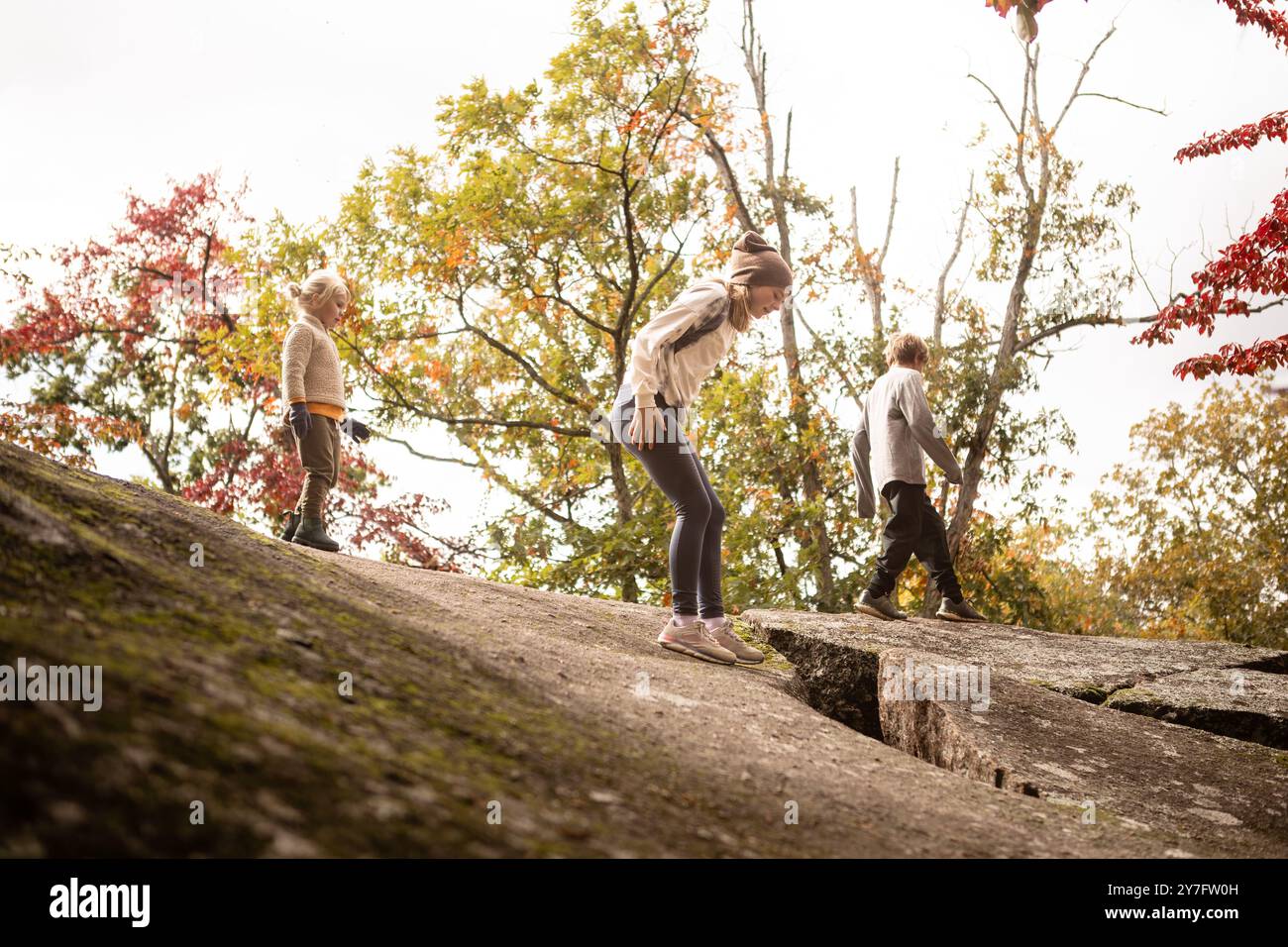 Children exploring rocky terrain on fall hike Stock Photo - Alamy