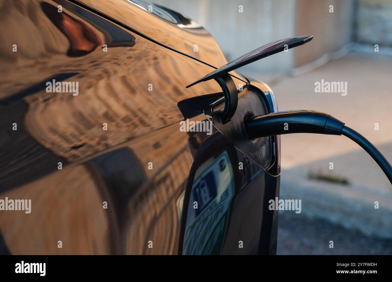 Close up of EV charger plugged into electric vehicle outside Stock ...