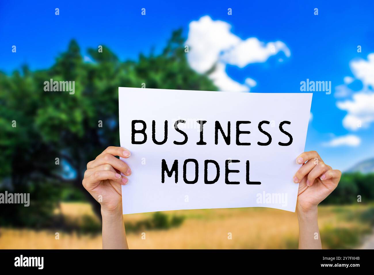 Business model message written on white paper with nature background ...