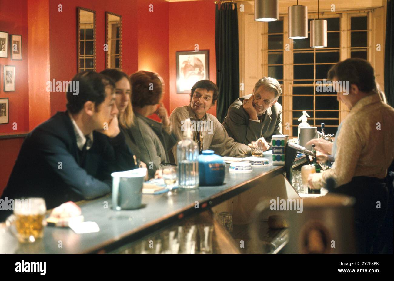 Pub. People sitting at bar Stock Photo - Alamy