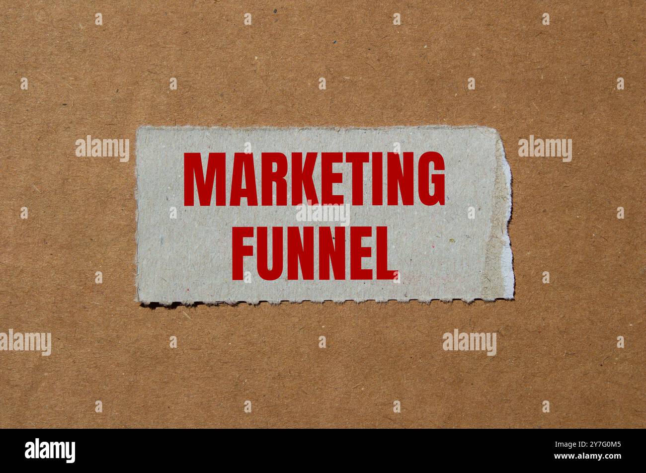 Marketing funnel message written on ripped torn paper piece with ...